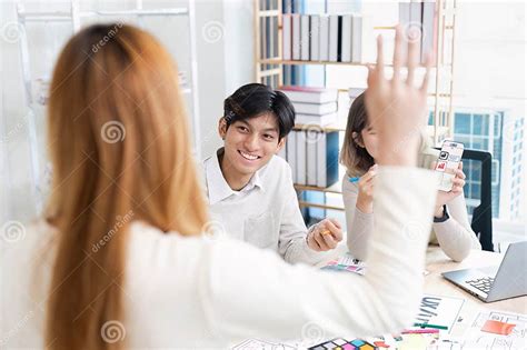 Creative Team Collaborating On Ux Ui Design Project In Modern Office Environment Stock Image