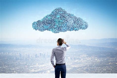 Back View Of Businessman Standing Under Abstract Digital Cloud With Programming Language On