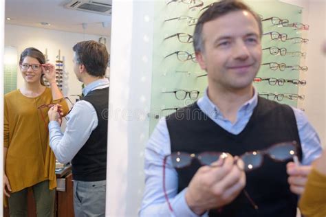 Pretty Female Try Eyeglasses With Optician Stock Image Image Of Optic