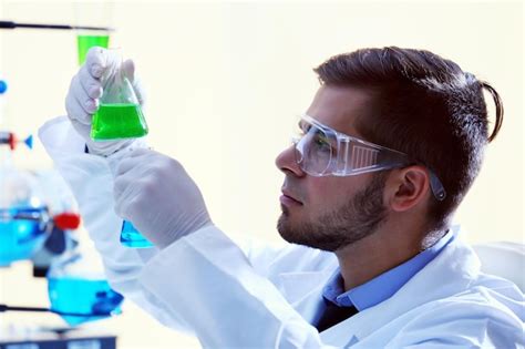Premium Photo Man In Laboratory Checking Test Tubes