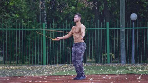 Man Exercising With Jumping Rope Yong Handsome Fit Man Jumping Rope On Stadium 53198745 Stock