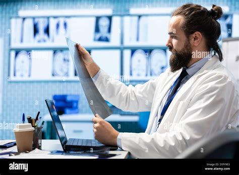 Licensed Physician Working On Finding The Right Diagnostic With X Ray