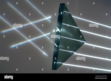 Light Rays And Triangular Prism As Light Rays Pass Between Transparent Materials Of Different