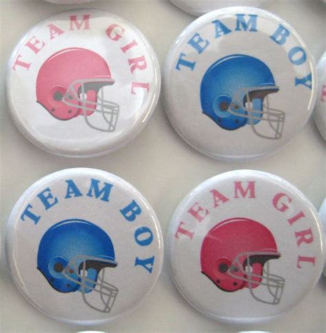 Several Buttons With Helmets On Them That Say Team Babe And Team Girl In Red White And Blue