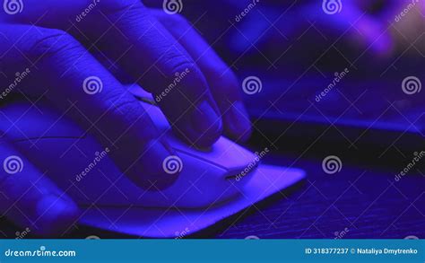 Man Using Computer Mouse When Working Online Desk At Night Stock Image