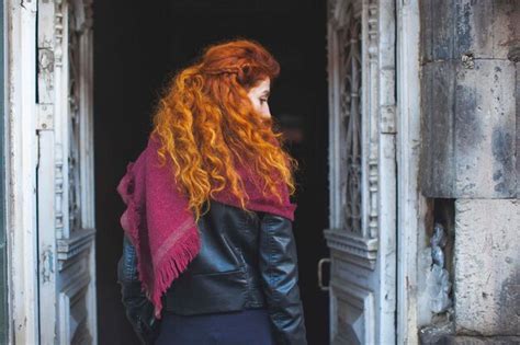 Premium Photo Rear View Of Redhead Woman Standing At Doorway