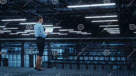 Data Center Engineer Using Laptop Computer Server Farm Cloud Computing Specialist Facility With