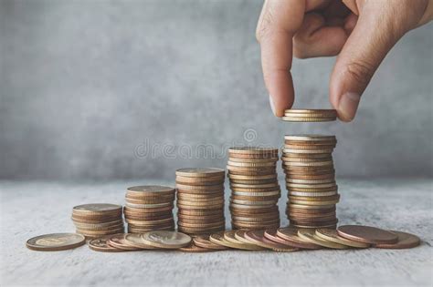 Coin Placed On Tallest Stack Symbolizing Saving And Financial Growth Stock Illustration
