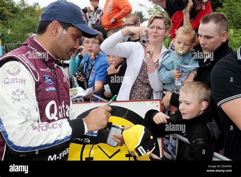 Qatari Rally Driver Nasser Al Attiya Signs Autographs After A Special