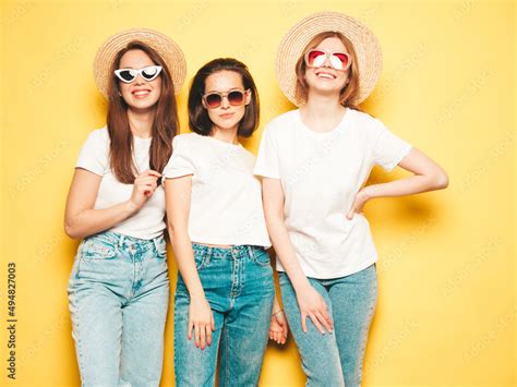 Three Young Beautiful Smiling Hipster Female In Trendy Summer White T