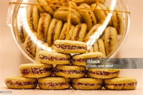 A Bunch Of Alfajores Looks Like Pyramid Behind There Is A Box Of