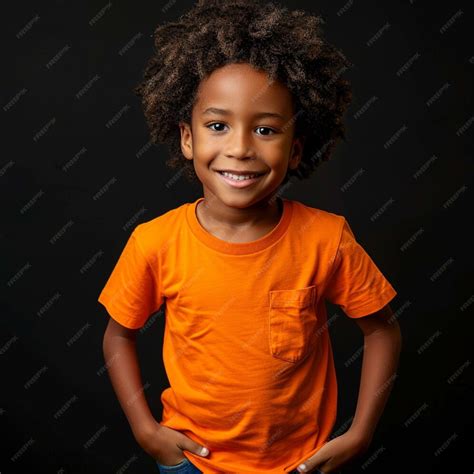 Premium Photo A Young Boy Wearing An Orange Shirt That Says I Love You