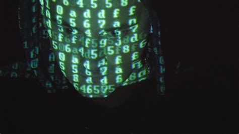 Male Face Of Hacker With Binary Code Projections Source Code Projected