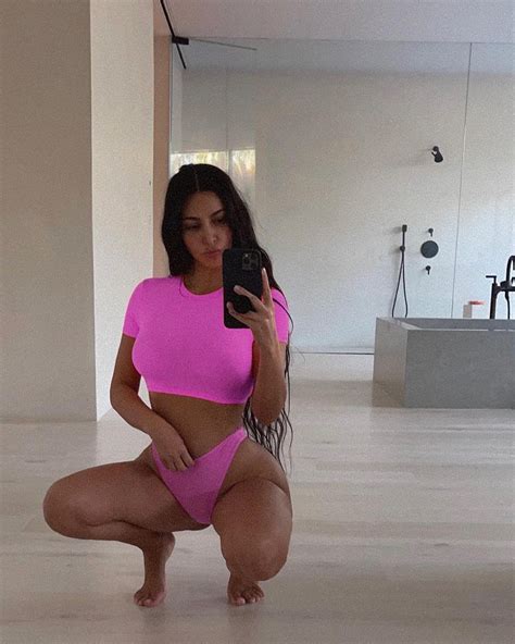 Kim Kardashians Seductive Curves In Pink Bikini 2 Photos The