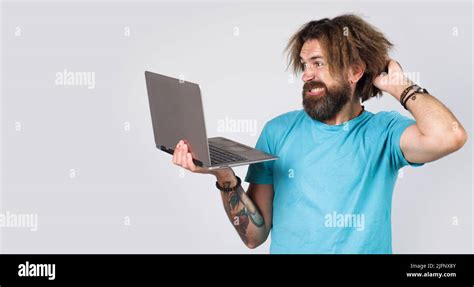 Confused Man With Laptop Computer Looking At Display Bearded Male With Notebook Digital Device