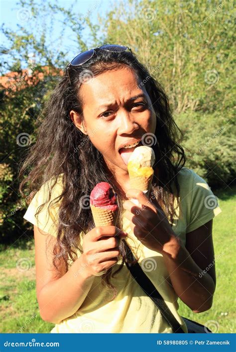Girl Licking Ice Cream Stock Image 58980805