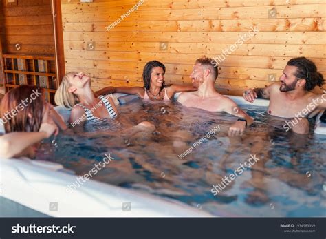 101 Group Of Friends Relaxing In A Luxurious Hot Tub Images Stock