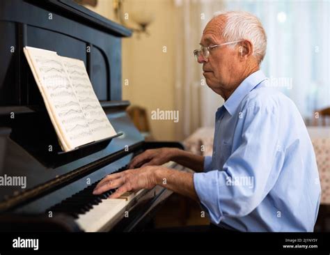 Man Playing Grand Piano