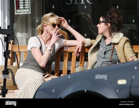 Melanie Griffith Smokes A Cigarette While Talking To A Friend In Brentwood Brentwood California