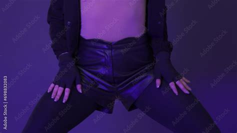 Woman Is Dancing At Nightclub Under Colorful Neon Lights Moving Her Body Rhythmically With