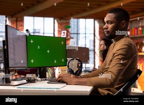 programmer coding in startup office using isolated screen pc building