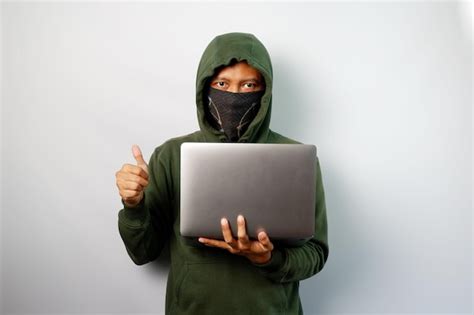 Premium Photo Hacker In Front Of His Laptop Trying To Steal Personal Data From People Isolated