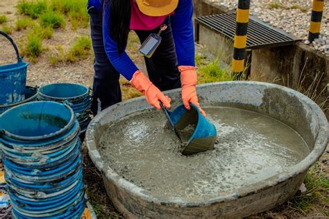 Premium Photo A Truck Female Worker Mixer Pouring Concrete Cement Into A Concrete