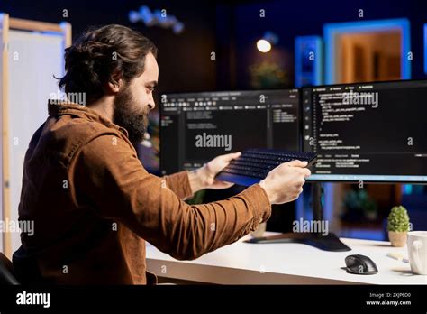 Angry Programmer Trying To Smash Keyboard In Frustration After Failing