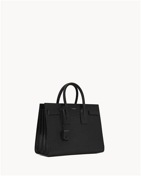 크로커다일 무늬가 새겨진 블랙 가죽 소재의 스몰 삭 드 주르 백 Saint Laurent Ysl Kr