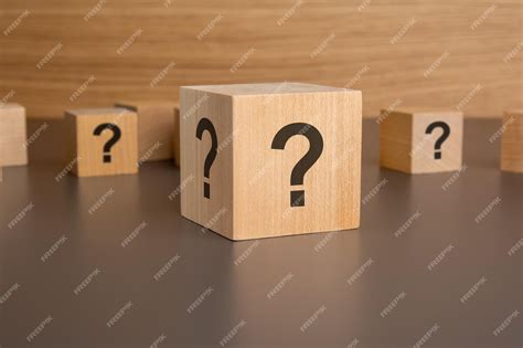 Premium Photo Wooden Cube Questions Signs On Its Sides Concept Of