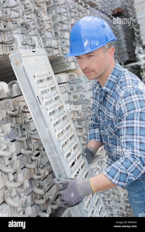 Worker Holding Scaffolding Platform Stock Photo Alamy