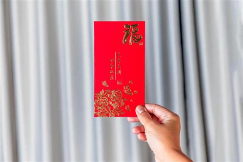 Red Envelope With Golden Chinese Symbols For Lunar New Year Celebration
