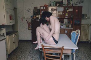 Curled Up On The Kitchen Table Porn Pic