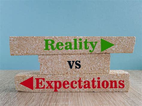 The Words Reality Vs Expectations Written On Brick Blocks Beautiful Wooden Table Blue