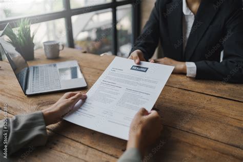 New Graduate Woman Filling Out An Application Form For HR Department Review And Review Your