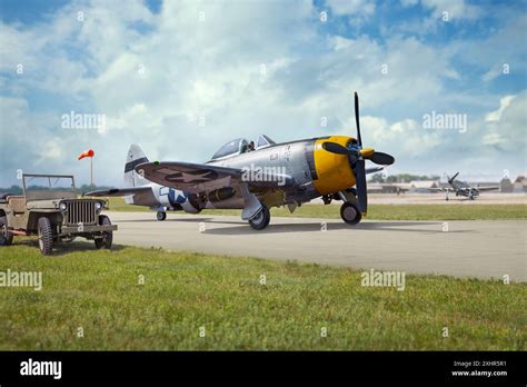 World War II Era P 47 Fighter Plane Model Alongside A Jeep Sits On A