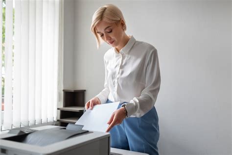 Free Photo Woman Using Printer While Working In The Office