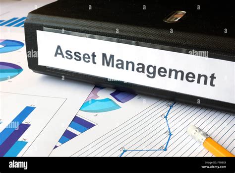 Graphs And File Folder With Label Asset Management Business Concept