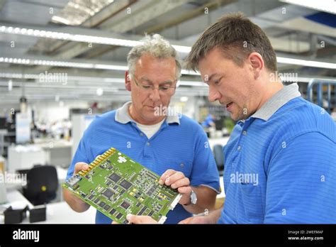 Working In A Microelectronics Manufacturing Factory Component Assembly And Soldering Group