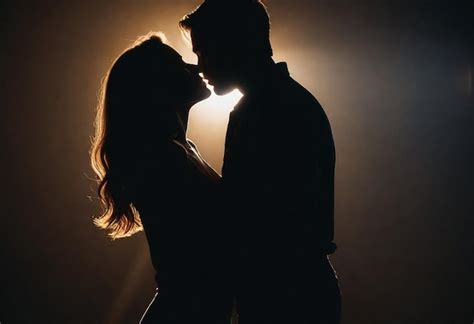 Premium Photo A Man And Woman Are Kissing In The Dark