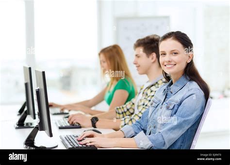 Three Smiling Babes In Computer Class Stock Photo Alamy