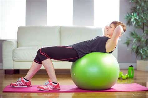 Premium Photo Fit Woman Doing Sit Ups On Exercise Ball