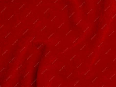 배경으로 사용되는 레드 벨벳 패브릭 질감 부드럽고 매끄러운 섬유 소재의 빈 빨간색 패브릭 배경 Textx9를 위한 공간이 있습니다 프리미엄 사진
