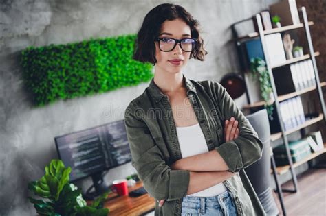 Confident Female Programmer Standing In A Modern Workspace Showcasing Technology And Creativity