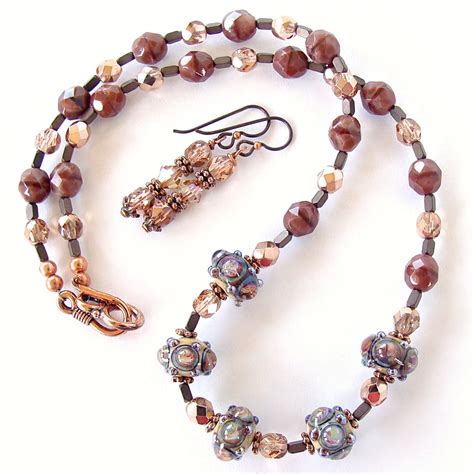 Ambrosia Handmade Glass Jewelry In Rose Tones Earth And Moon Design