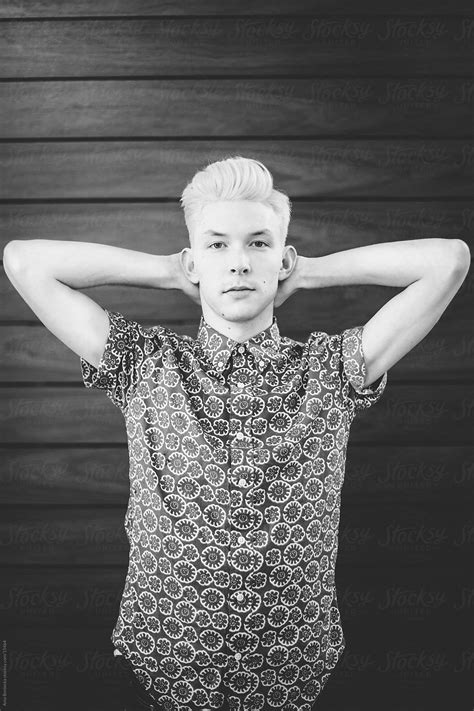 A Portrait Of A Blonde Man With Hands Behind His Head By Stocksy Contributor A Model