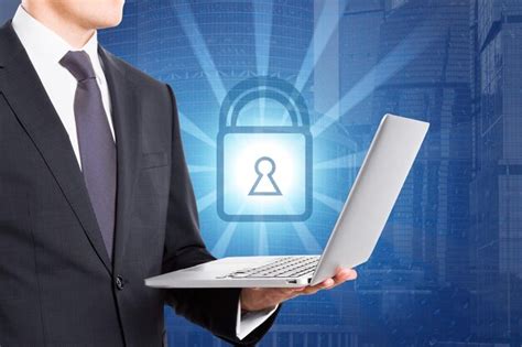 Premium Photo Close Up Of Businessman Hand Holding Laptop With Glowing Padlock On Coding City