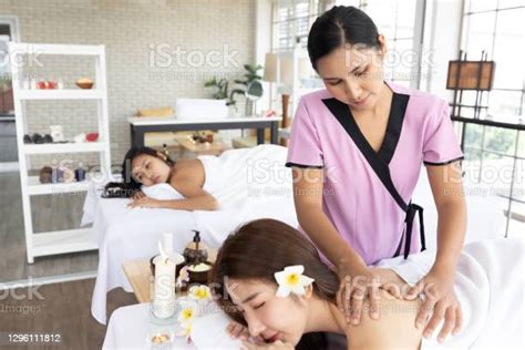 Young Asian Masseur Having Massage On Woman Customer In Spa Salon Stock