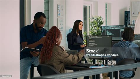 African American Team Of Cloud Programers Talking About Programming