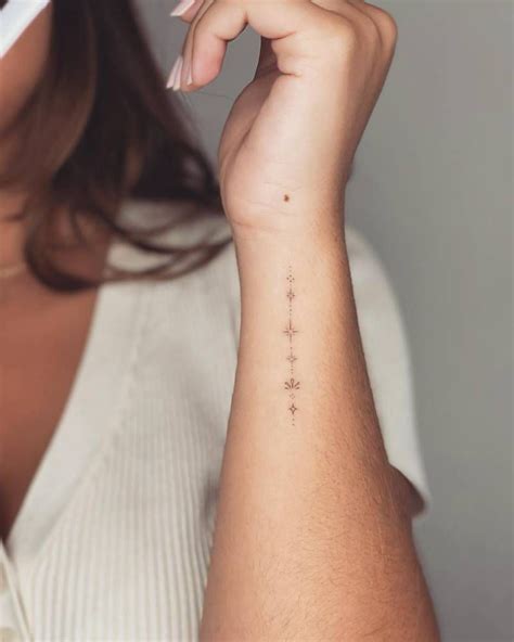 Fine Line Style Symbol Chain Tattooed On The Wrist Side Wrist